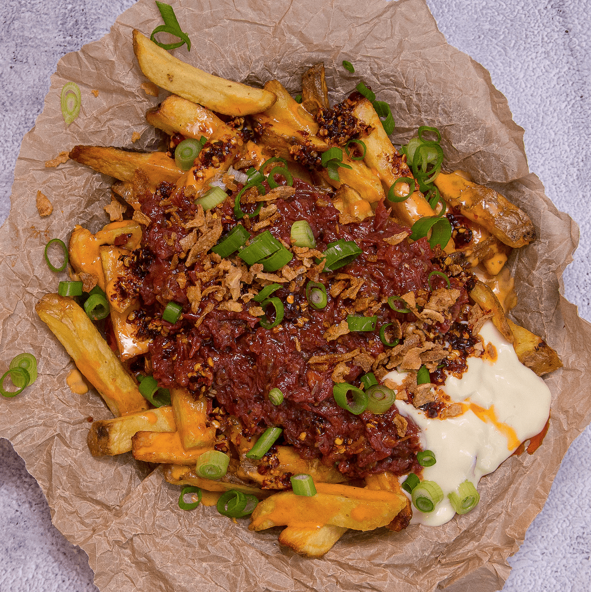 Loaded fries met pulled beef and wasabi mayo